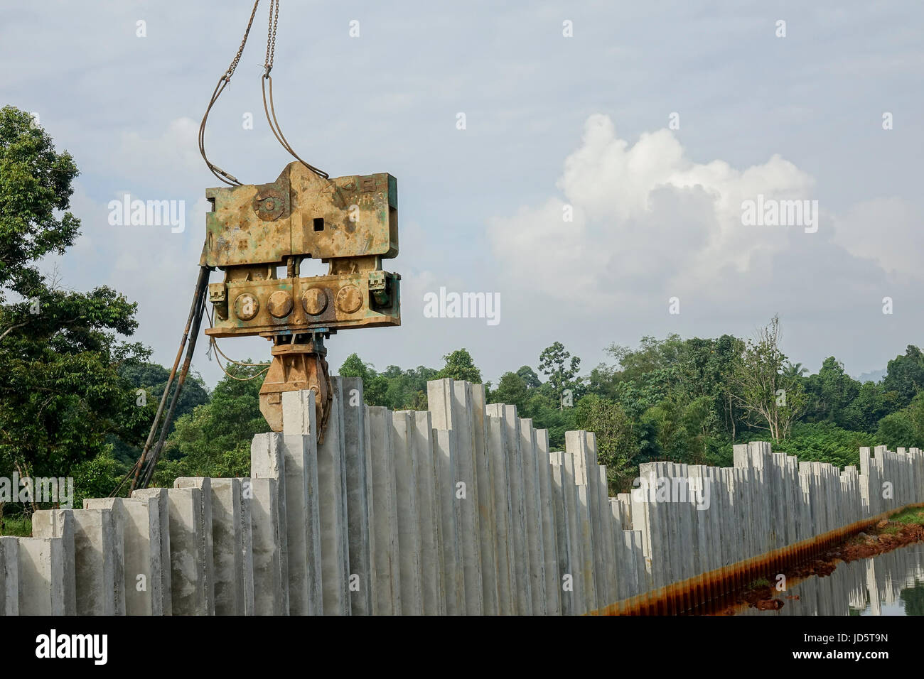 Piling machine works on a bridge pile construction Stock Photo - Alamy