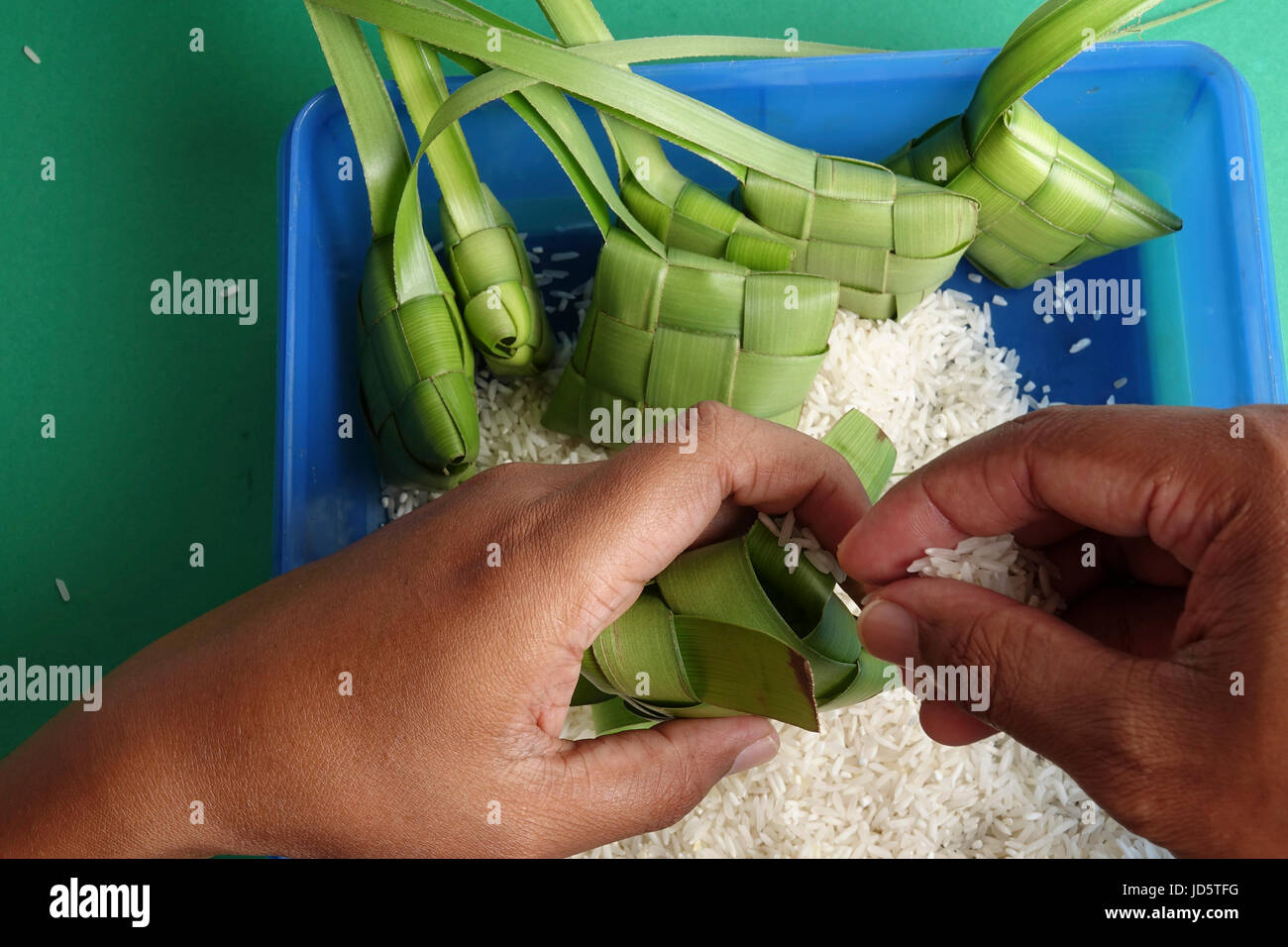 Making dumpling rice (ketupat nasi Stock Photo - Alamy