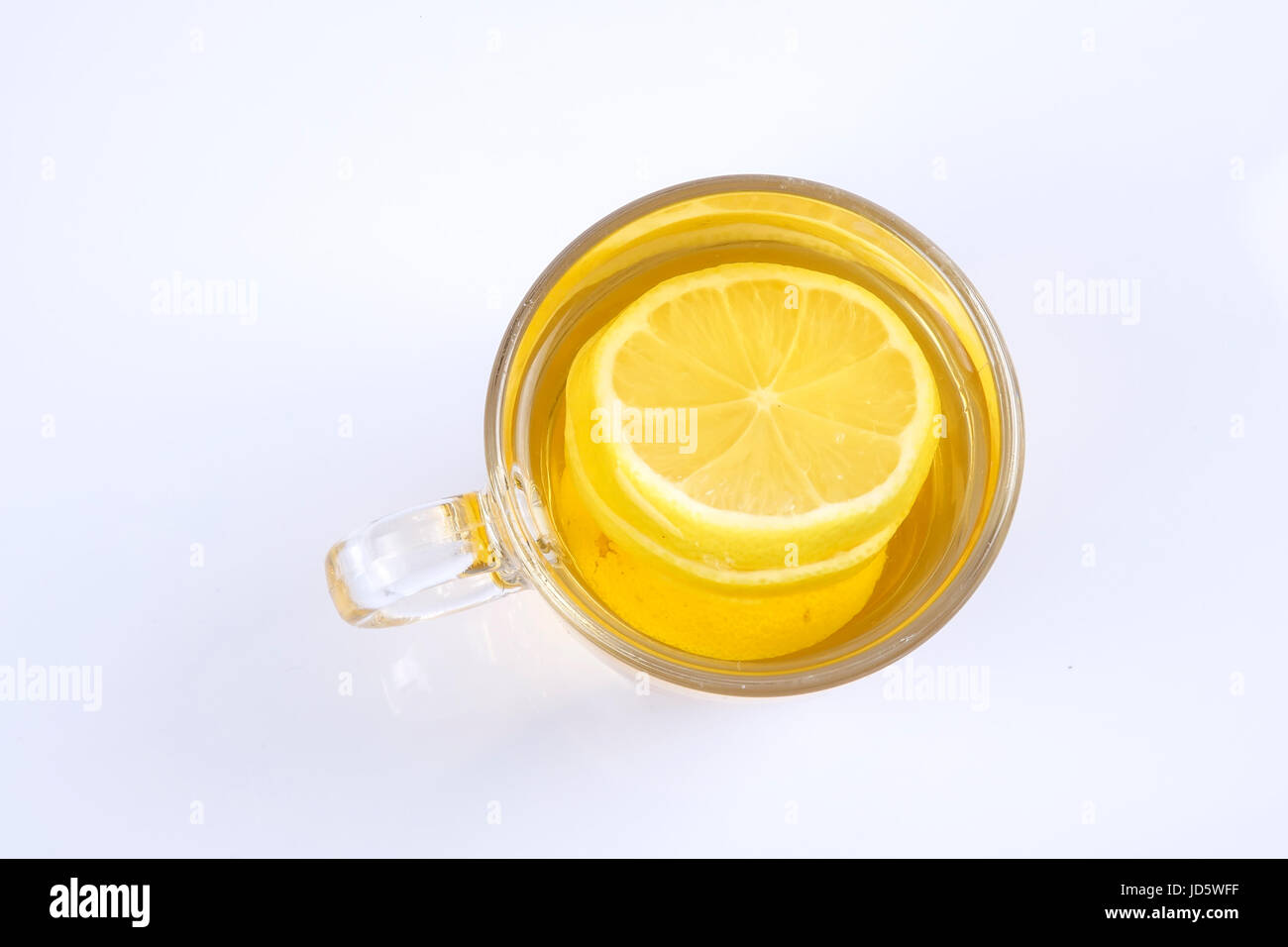 Hot lemon tea in the glass on white background Stock Photo - Alamy