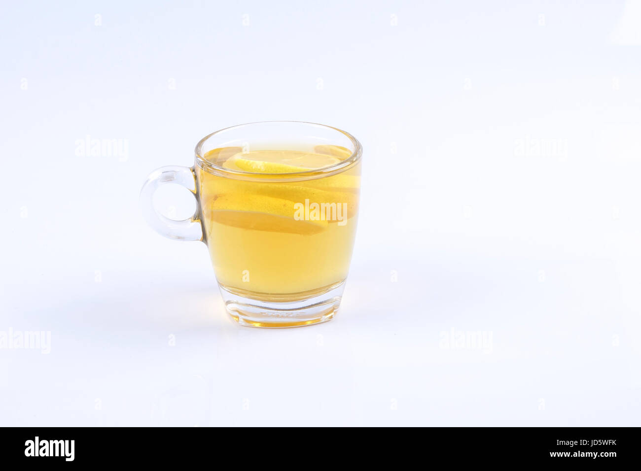 Hot lemon tea in the glass on white background Stock Photo - Alamy