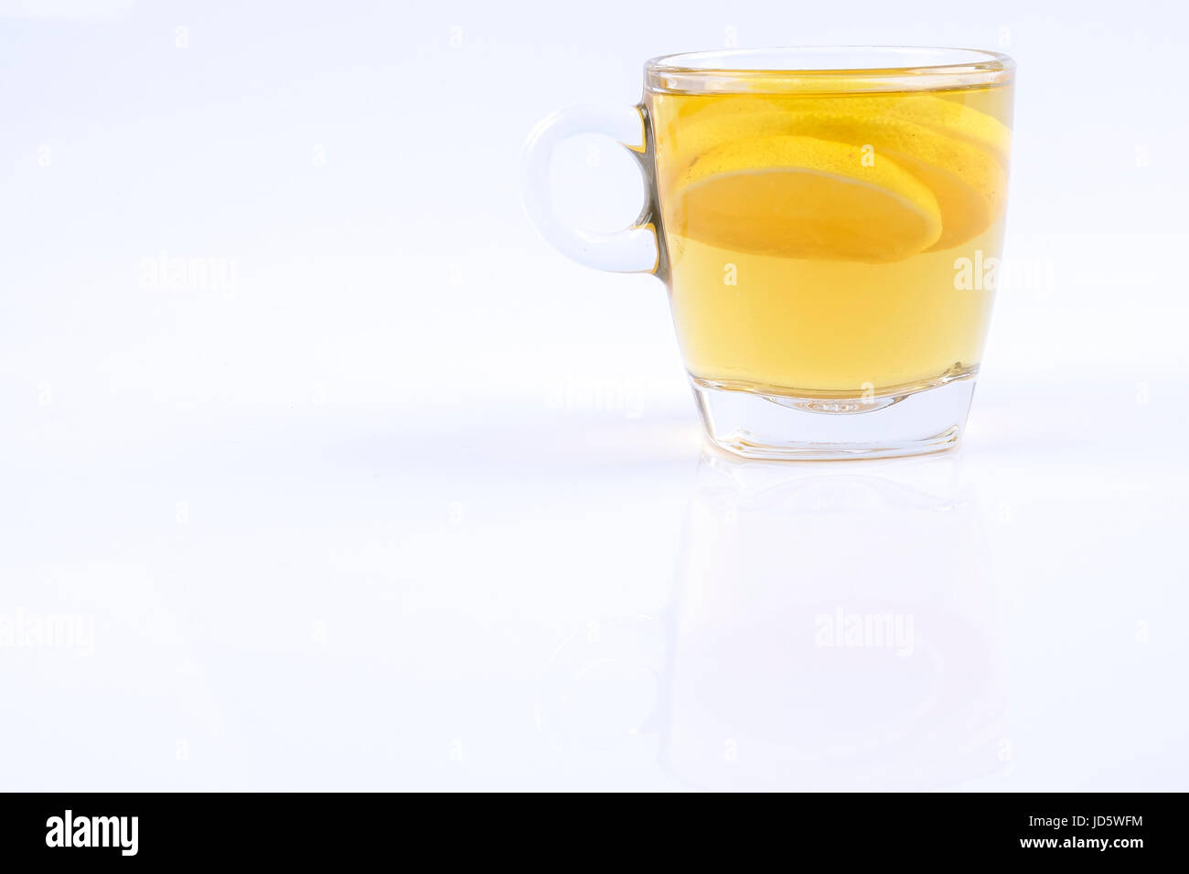 Hot lemon tea in the glass on white background Stock Photo - Alamy