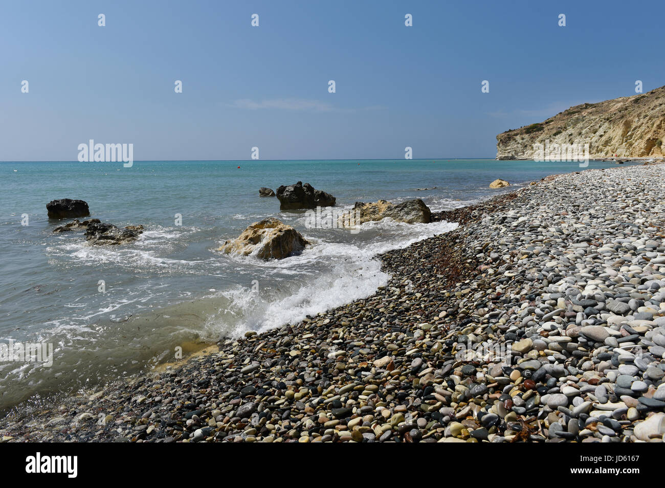 Beach with pebble stones and beautiful tropical sea. Summer vacation ...