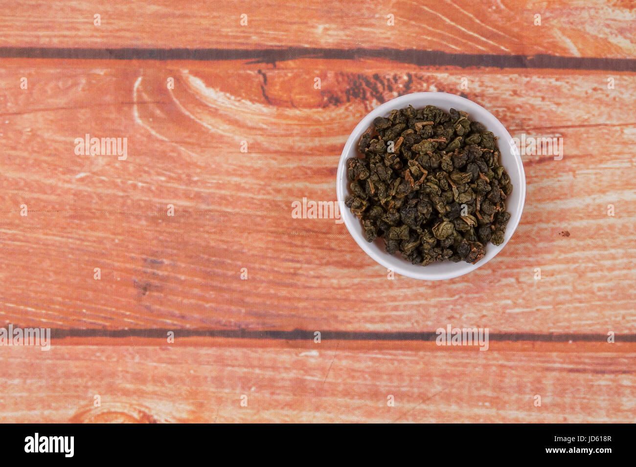 dried chinese tea leaves in a small bowl over wooden background Stock ...