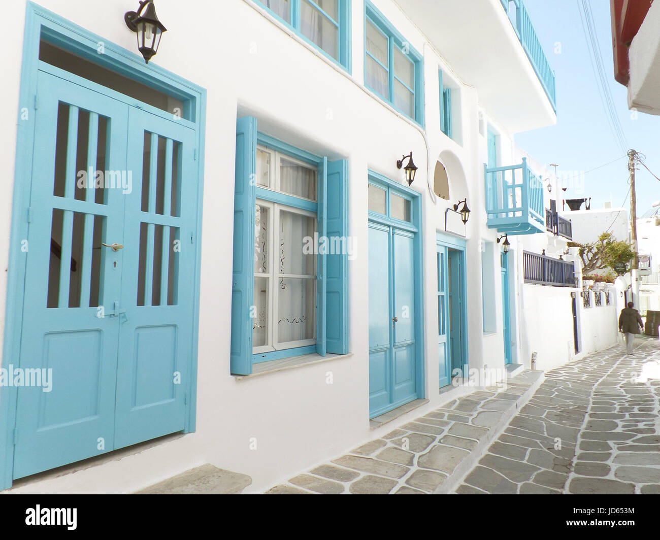 Charming small alley with white and blue colored buildings, Mykonos ...