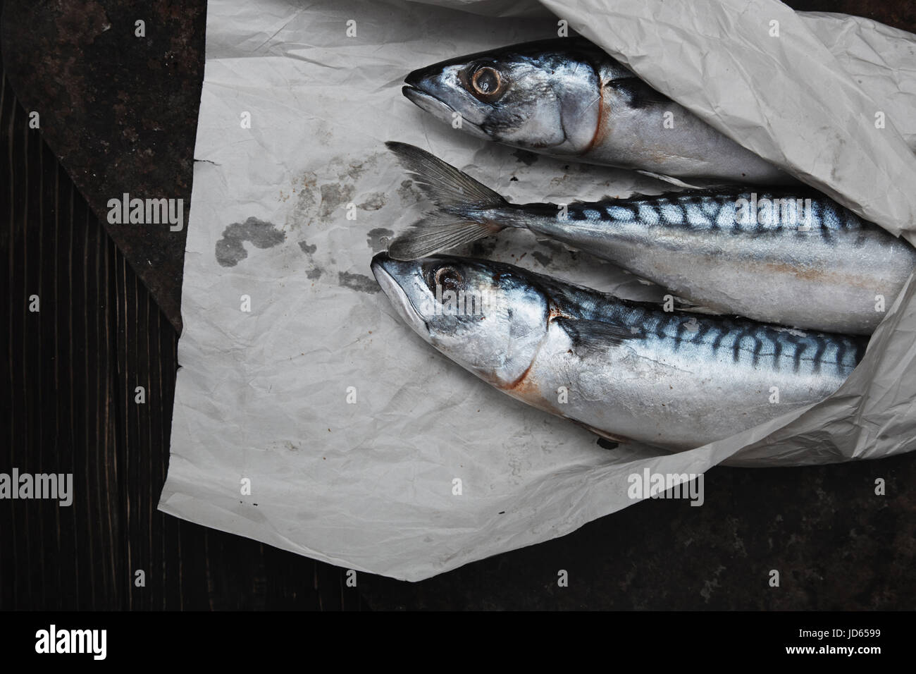 Scomber fish in wrapping paper Stock Photo - Alamy