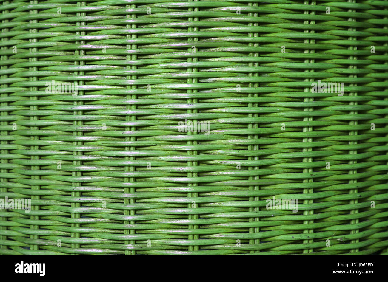 Front view of vibrant green colored rattan furniture surface, for ...