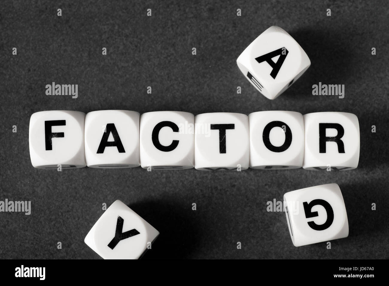 word factor on white toy cubes Stock Photo - Alamy