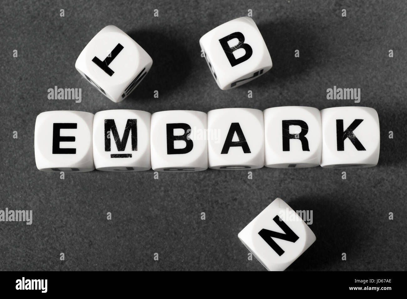 word embark on white toy cubes Stock Photo - Alamy