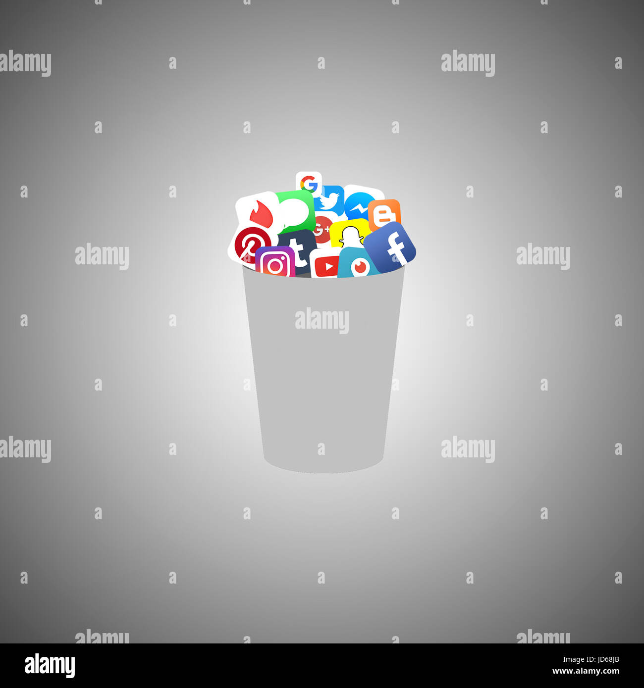 Various social media app icons tossed into a trash bin, concept of ...