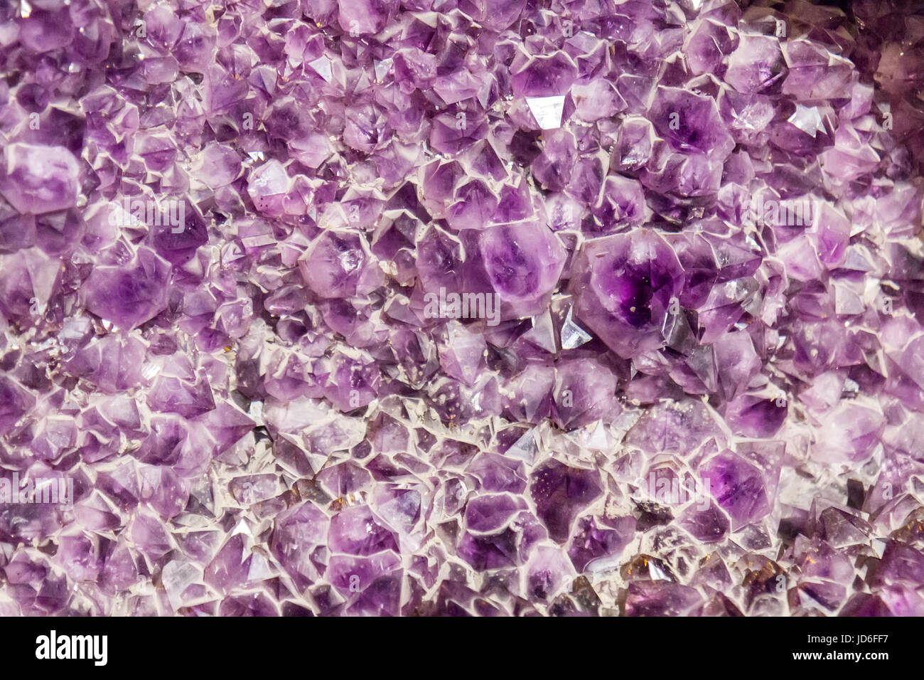 Natural amethyst crystal background Stock Photo - Alamy