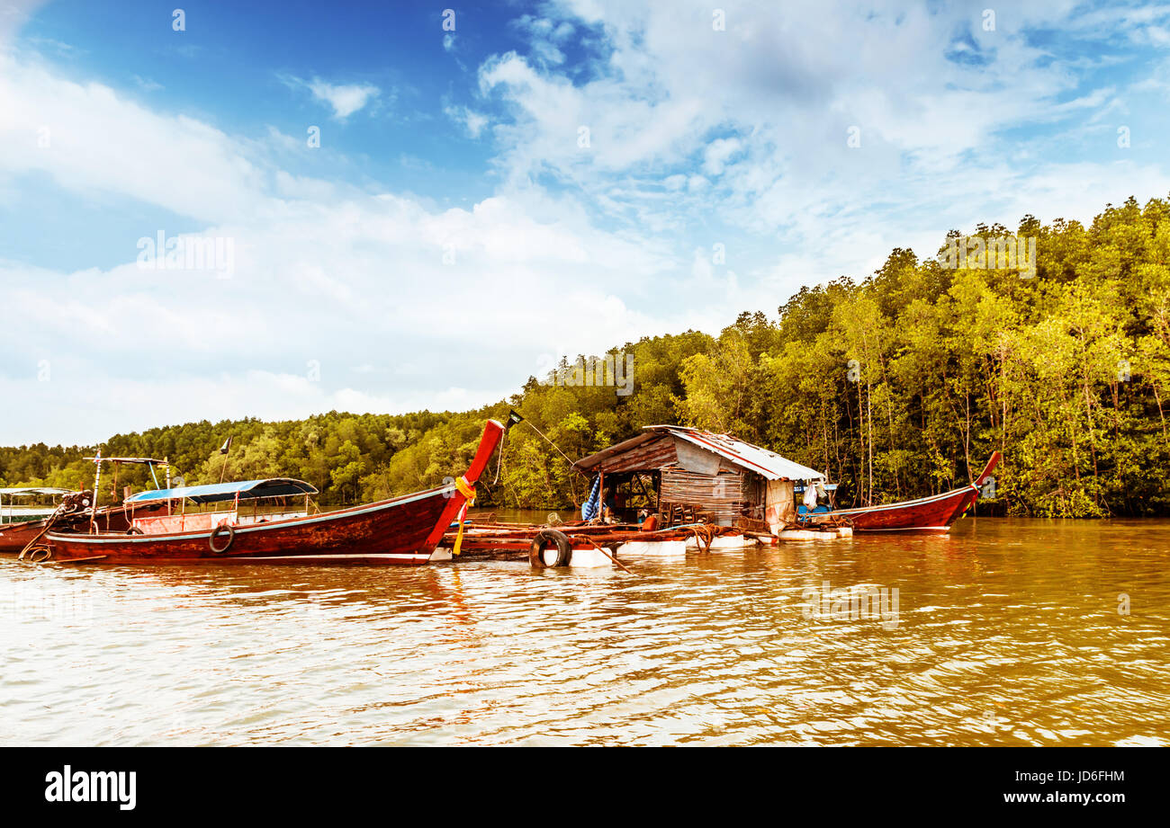 Traditional wooden longtail boat on Pak Nam Krabi river, Thailand Stock ...