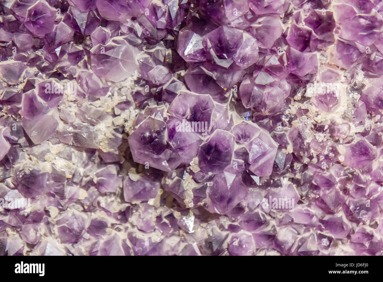Natural amethyst crystal background Stock Photo - Alamy