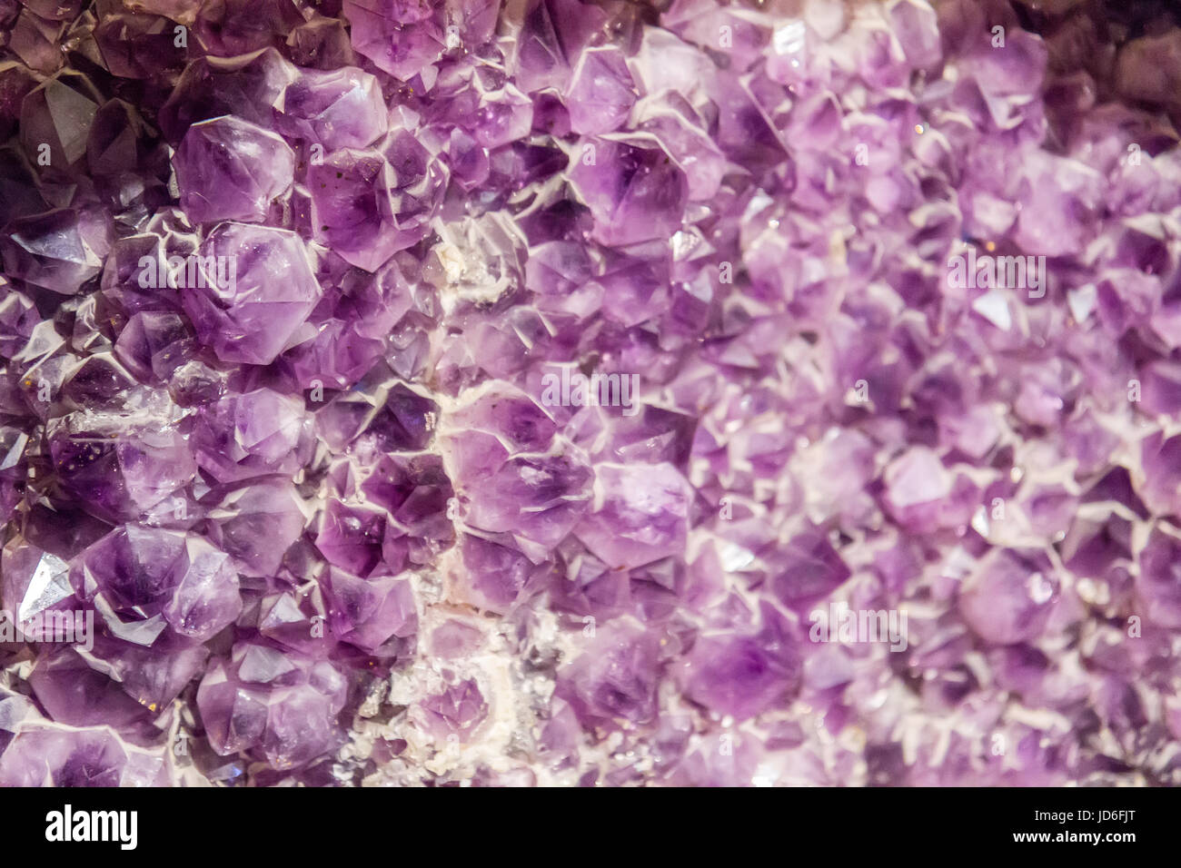 Natural amethyst crystal background Stock Photo - Alamy
