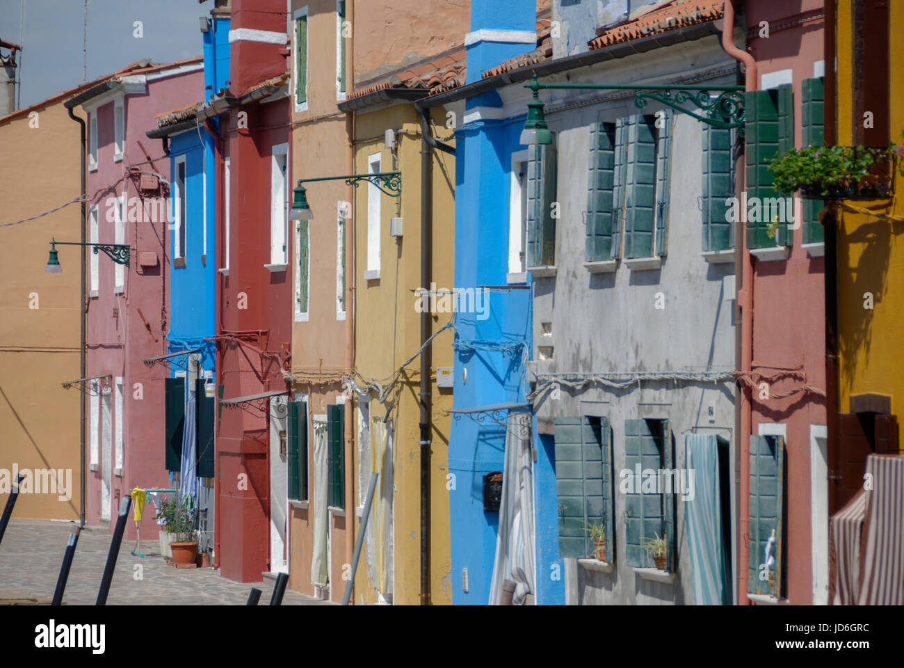 BURANO, ITALY - APRIL 18, 2009: Street with colorful buildings in ...