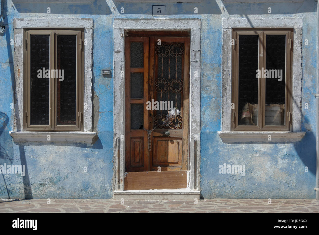 BURANO, ITALY - APRIL 18, 2009: Street with colorful buildings in ...
