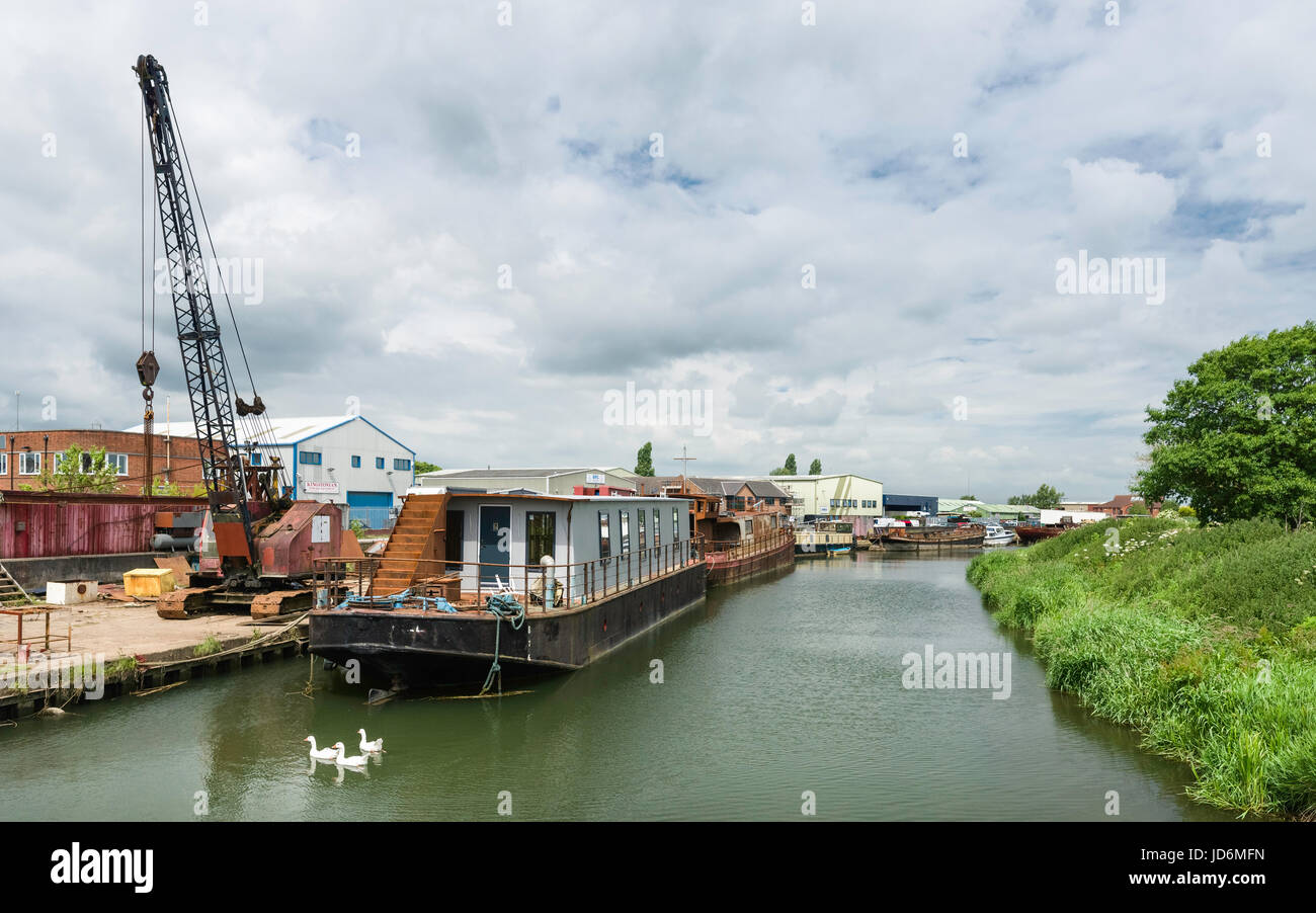 Renovated, as well as derelict, river boats in various stages of ...