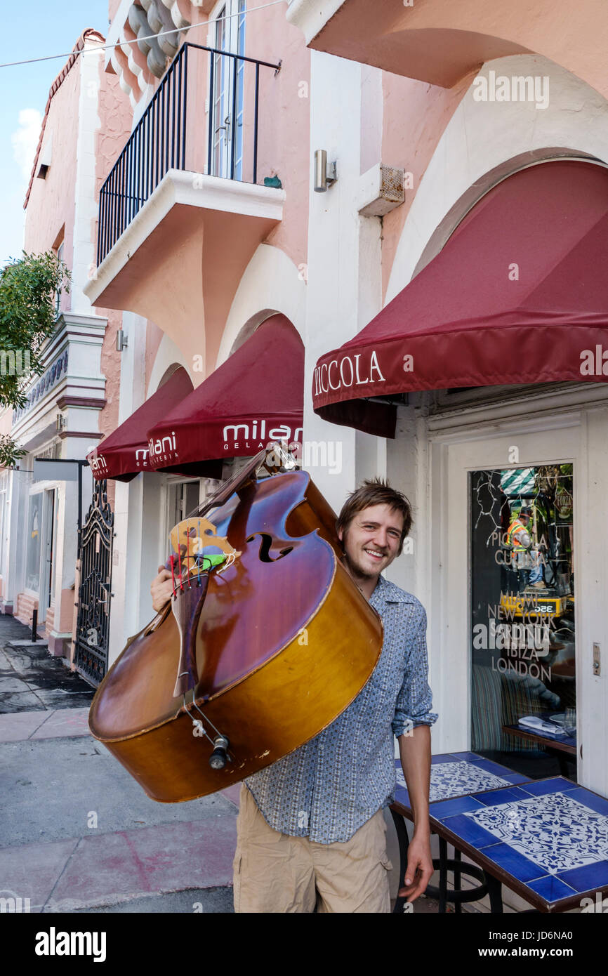 Man carrying double bass musical instrument hi-res stock photography ...