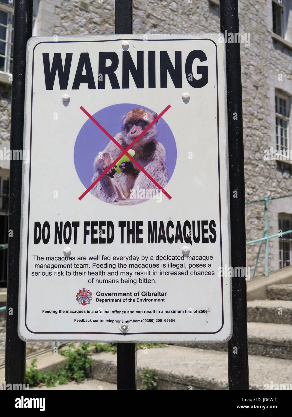 Warning sign feed macaques hi-res stock photography and images - Alamy