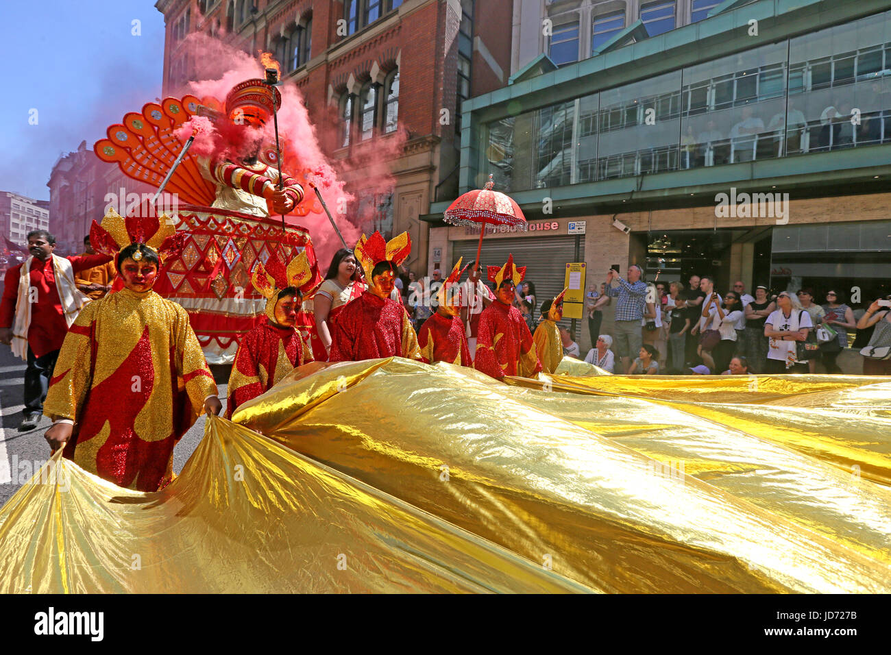 Manchester, UK. 18th June, 2017. Red smoke surrounds a magical model ...