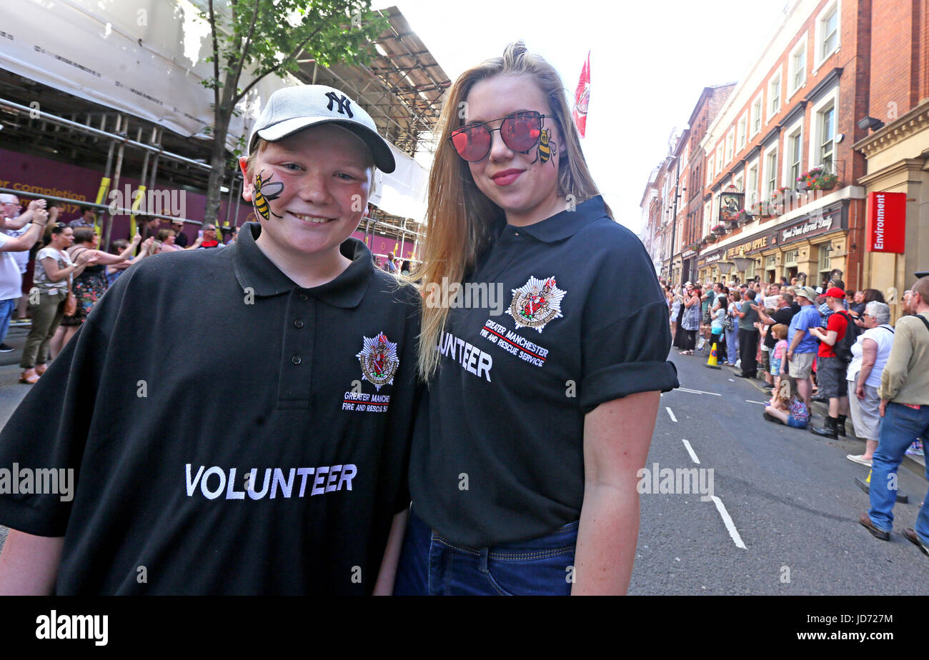 Manchester, UK. 18th June, 2017. Two young volunteers with the ...
