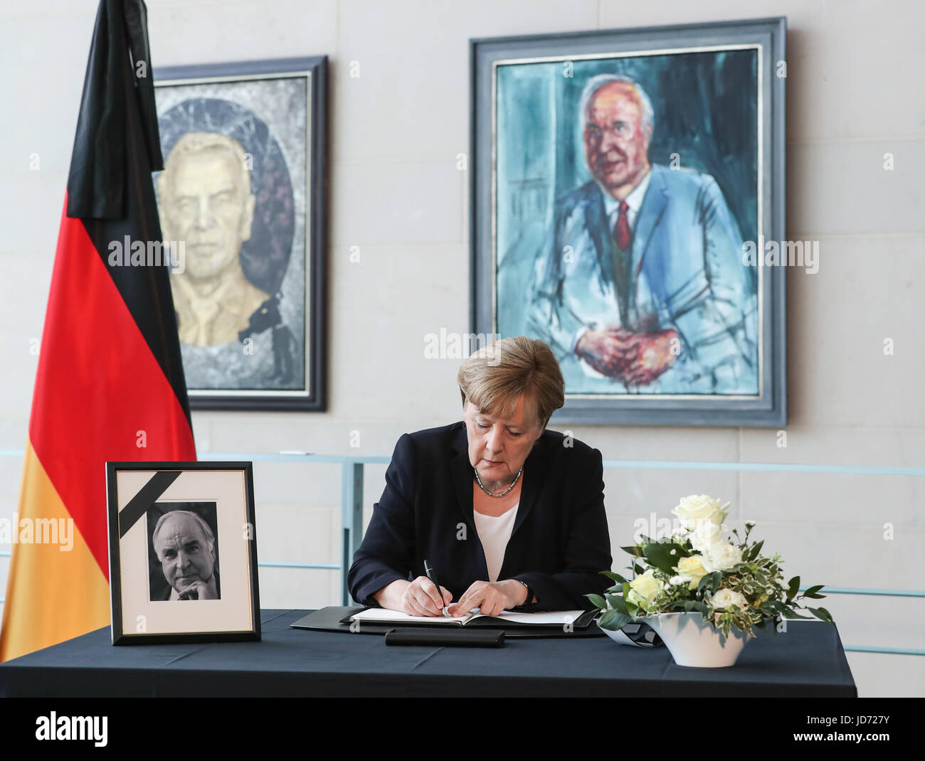 Berlin, Germany. 18th June, 2017. German Chancellor Angela Merkel signs ...