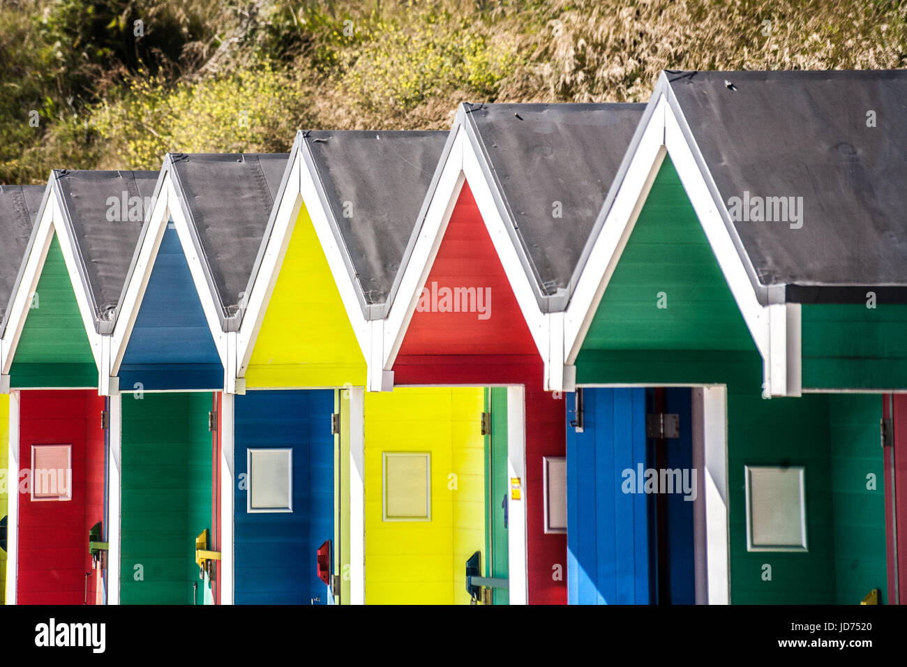 Barry, UK. 18th June, 2017. Colourful beach huts are seen as crowds ...