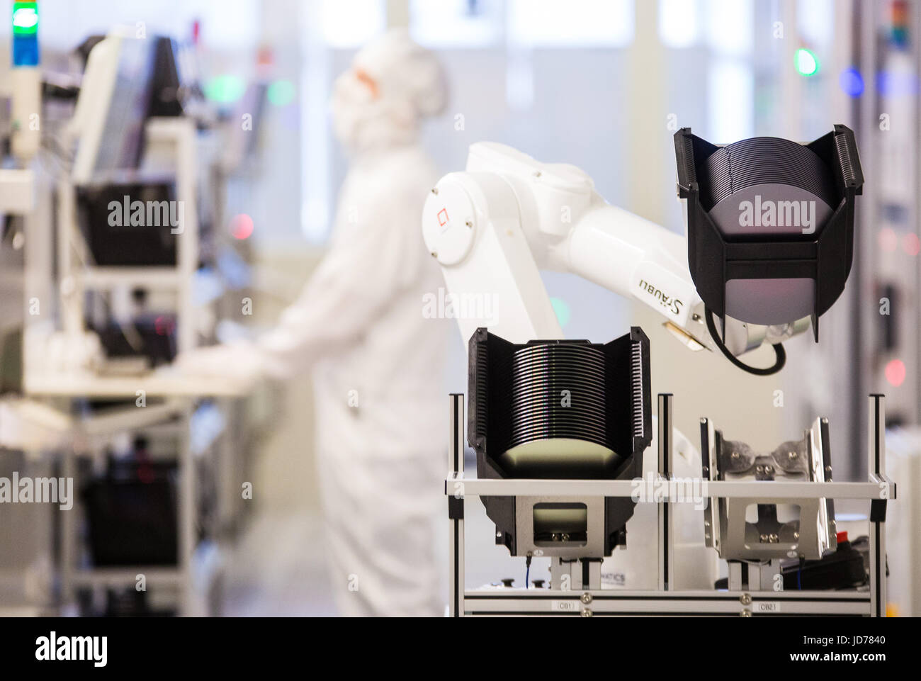Reutlingen, Germany. 16th June, 2017. A loading robot in a wafer fab ...