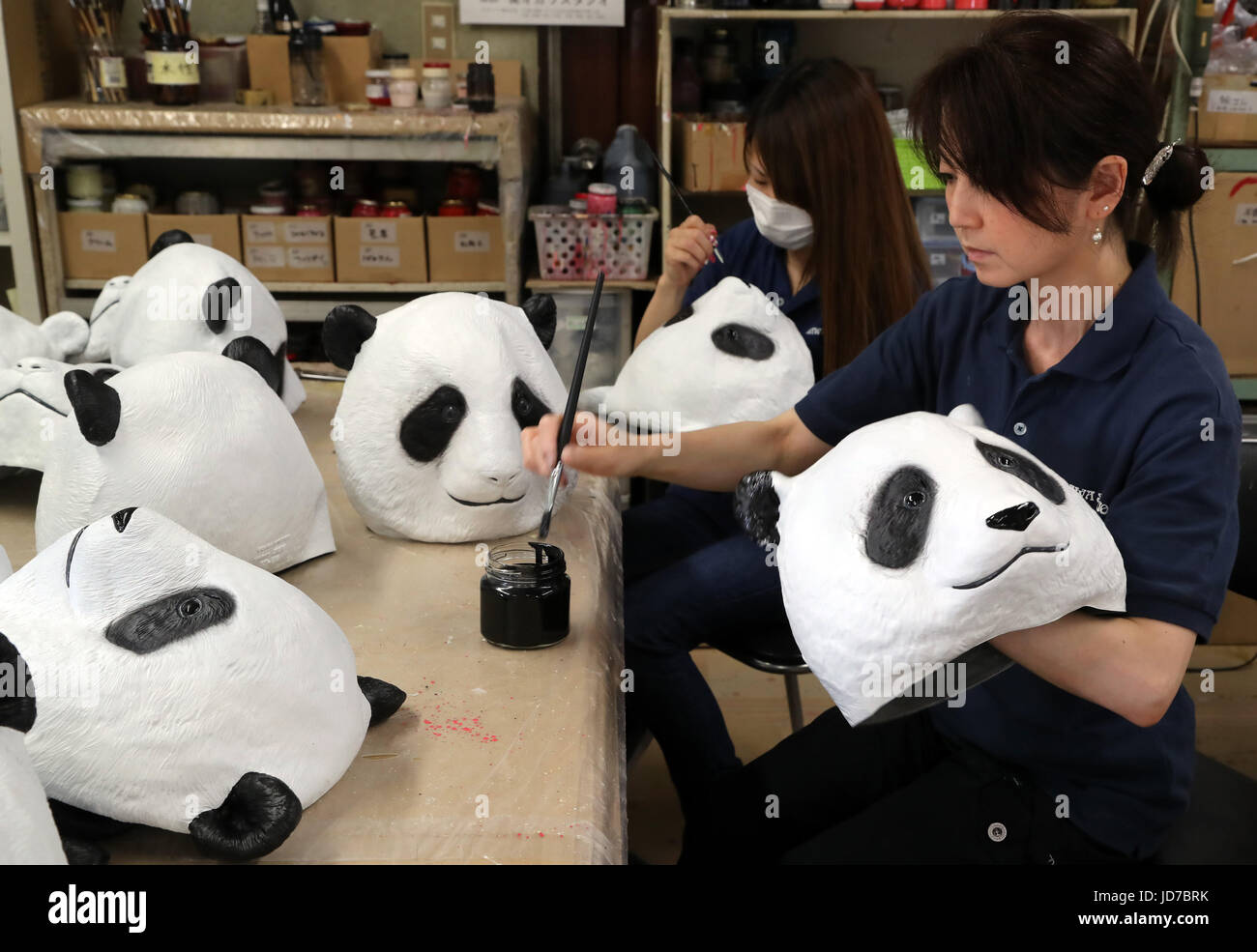 Saitama, Japan. 19th June, 2017. Employees of Japanese toy mask maker ...