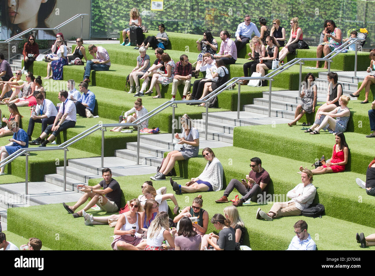 London, UK. 19th June, 2017. People relaxing in Granary Square on a hot ...