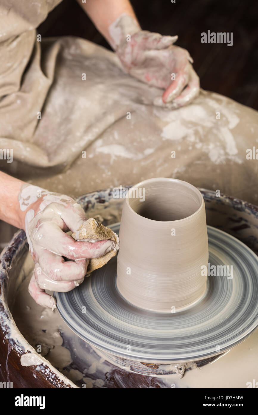 pottery, workshop, ceramics art concept - man works with potter's wheel ...
