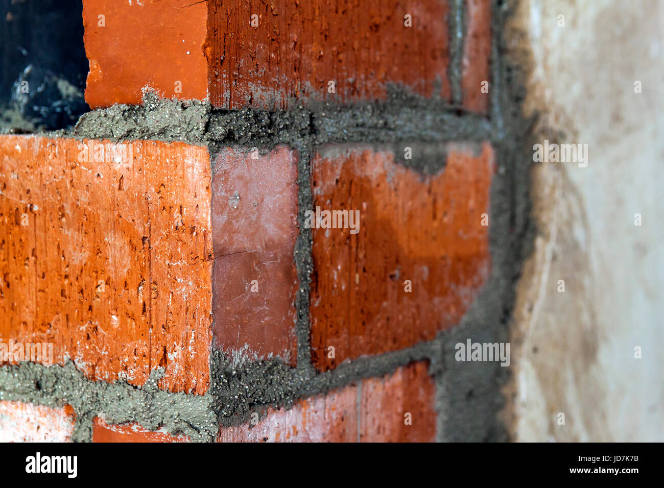 Close up of bricklaying industrial installing bricks on construction ...