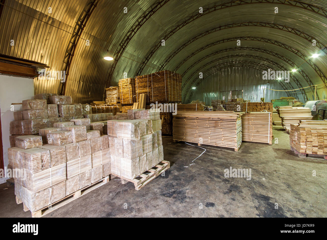 Warehouse packed with variety of timber for construction and repair ...