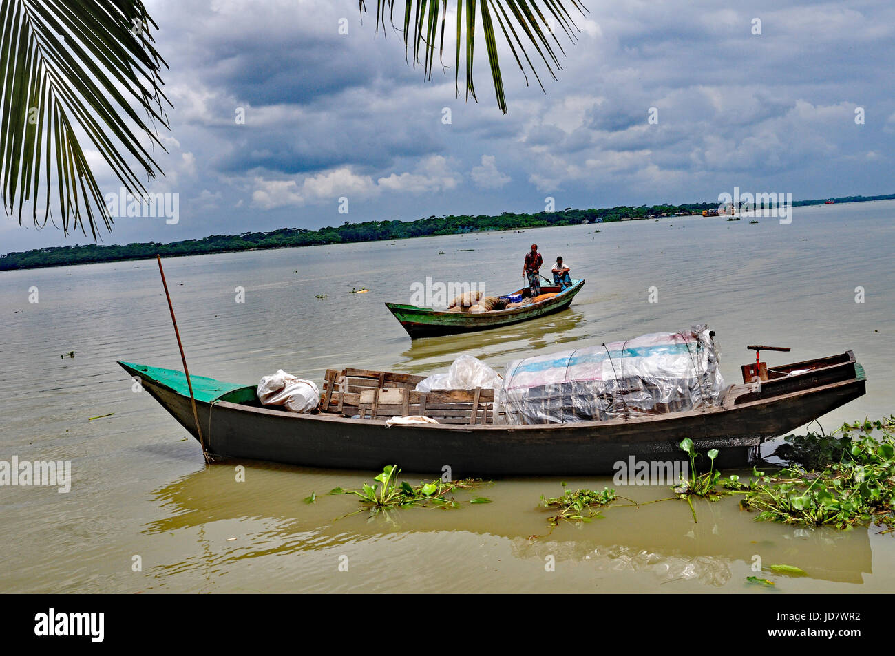 Two boatmen standing on the boat hi-res stock photography and images ...