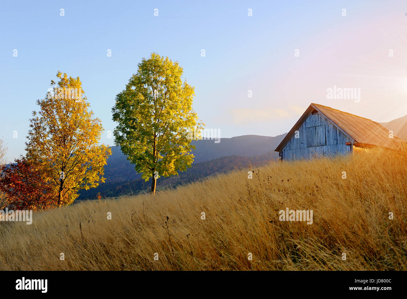 Mountain autumn landscape with houses Stock Photo - Alamy