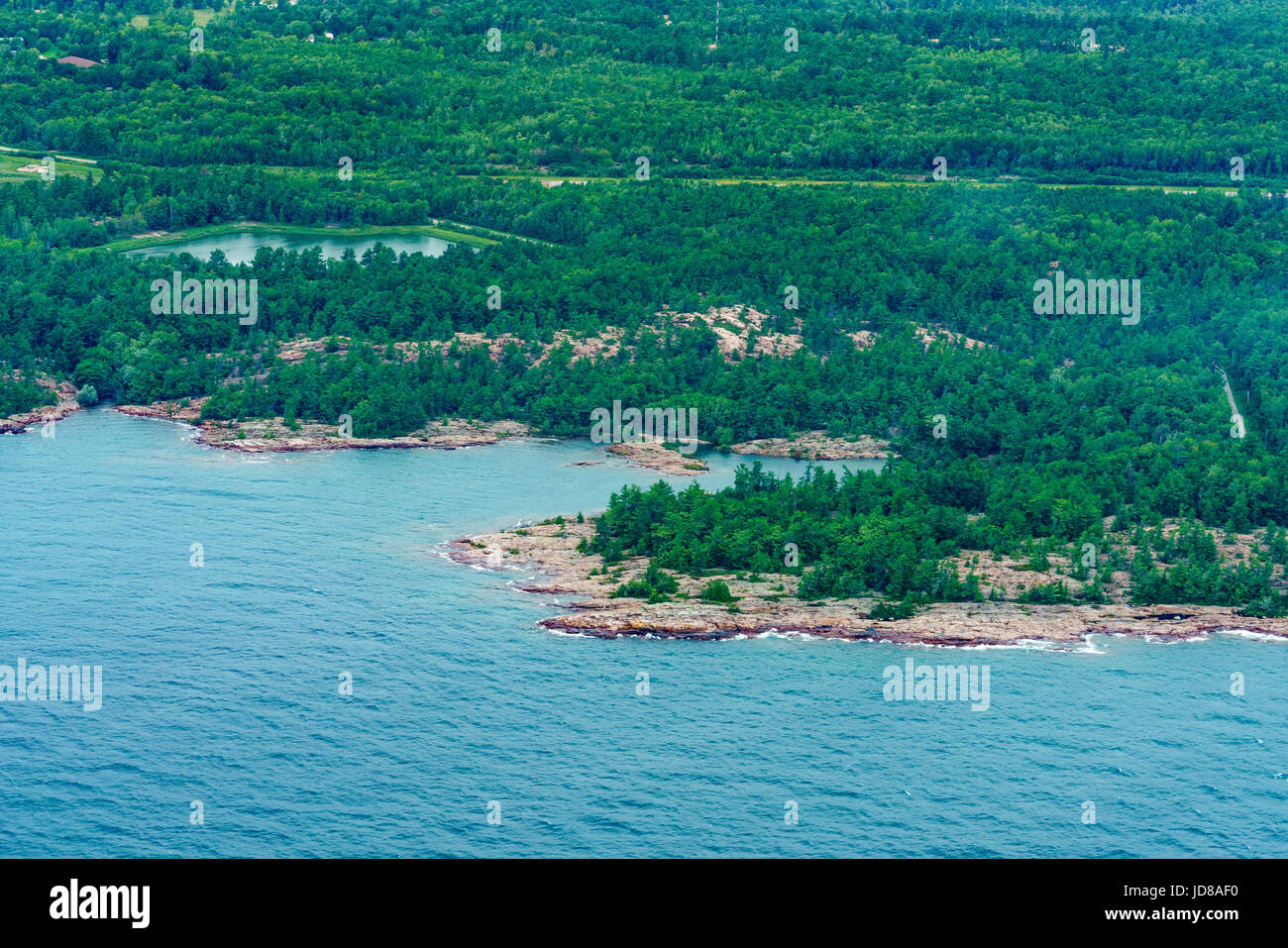 High angle view of coastline with trees and rocks, Toronto, Ontario ...
