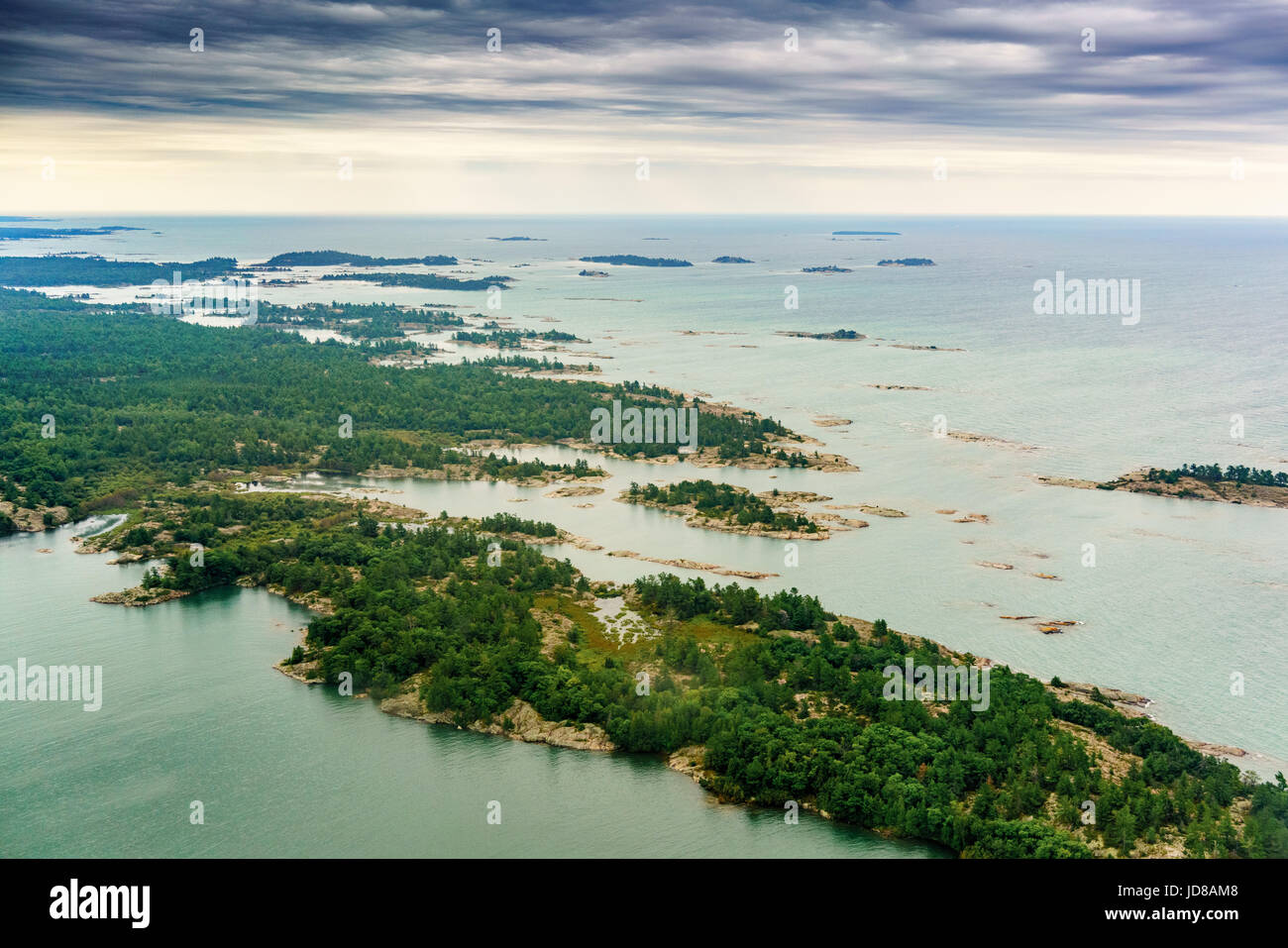 High angle view of coastline with offshore rocks and trees, Toronto ...
