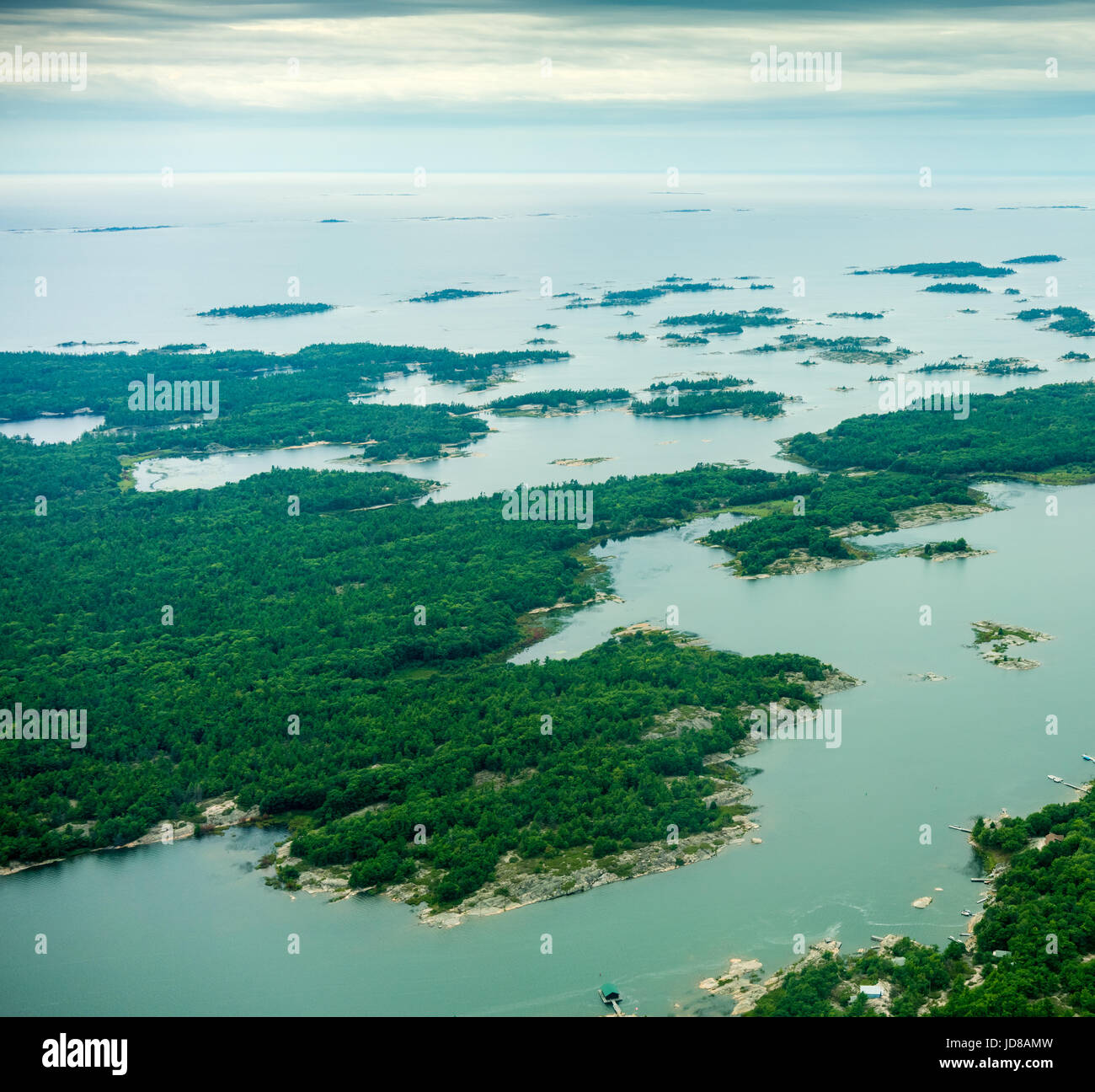 High angle view of coastline with trees and offshore rocks, Toronto ...
