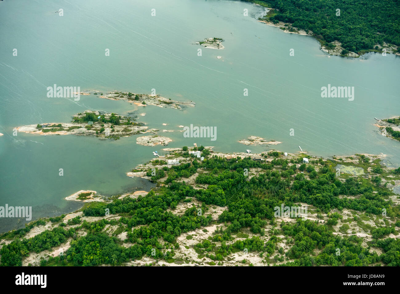 High angle view of coastline with trees and offshore rocks., Toronto ...