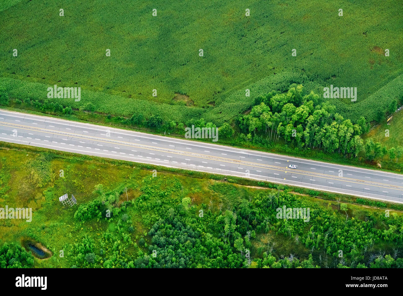 Elevated view of highway through middle of fields hi-res stock ...