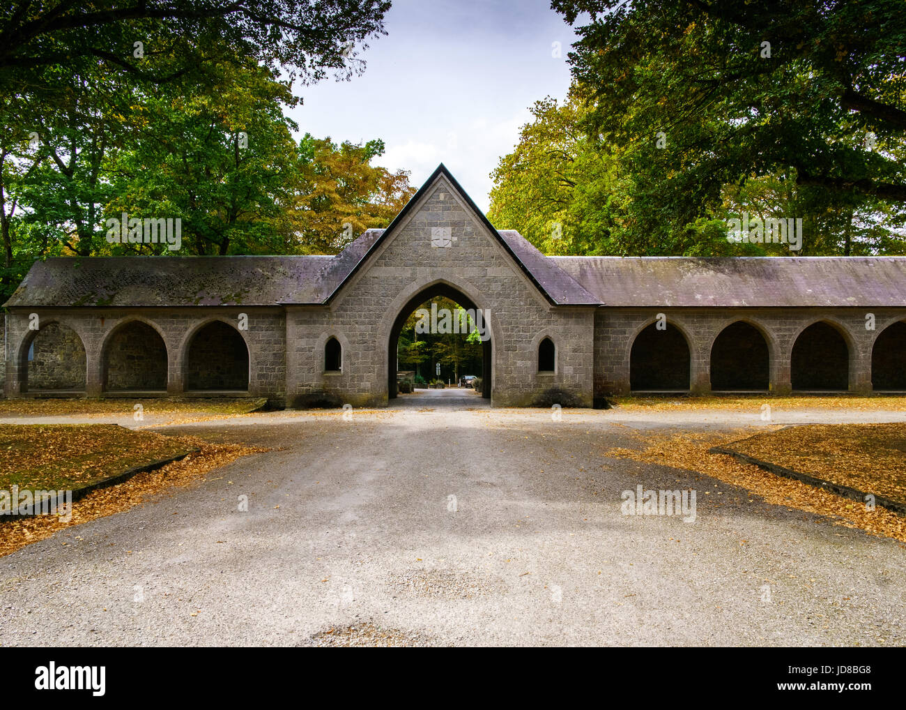 Drive leading to entrance archway and long low building hi-res stock ...