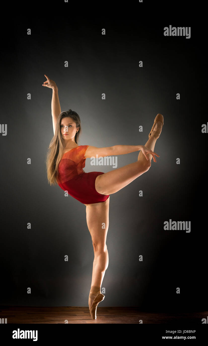 Female ballet dancer on one leg with arms stretched hi-res stock ...