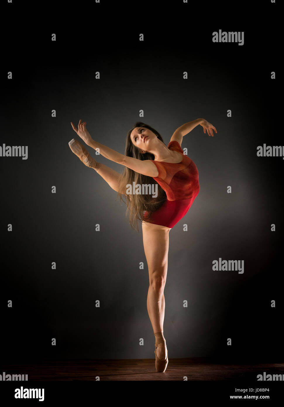Female Ballet Dancer On One Leg With Arms Stretched Hi Res Stock