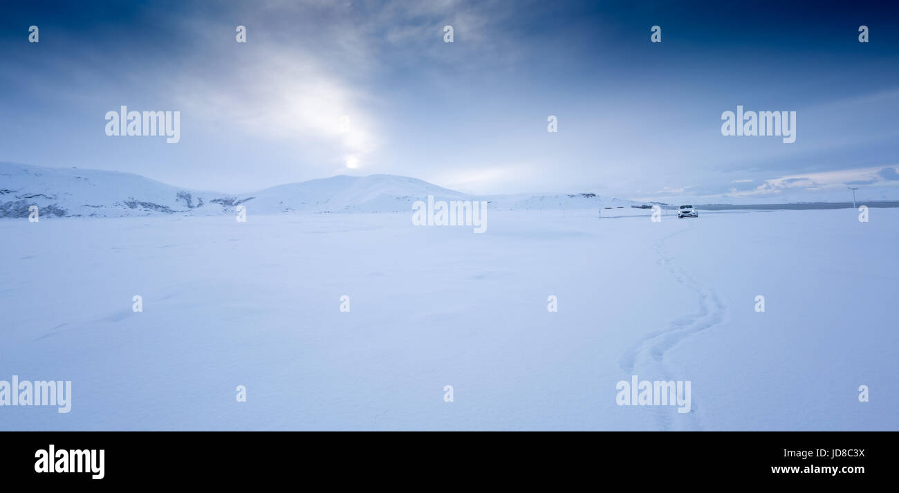 Snow covered landscape, blue sky and distant mountain, Iceland, Europe ...