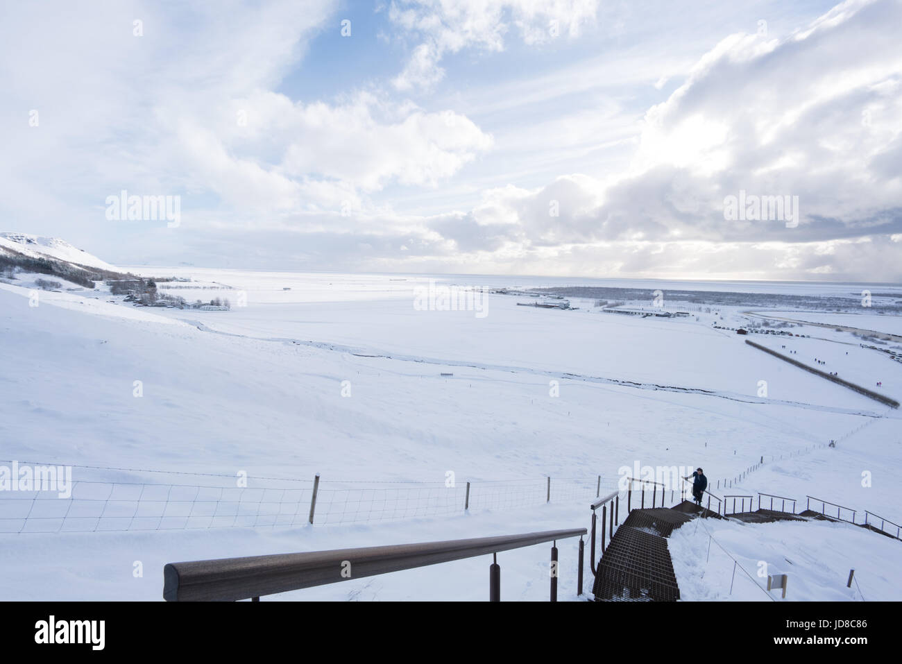Person ascending steps in deep snow covered landscape, Iceland, Europe ...