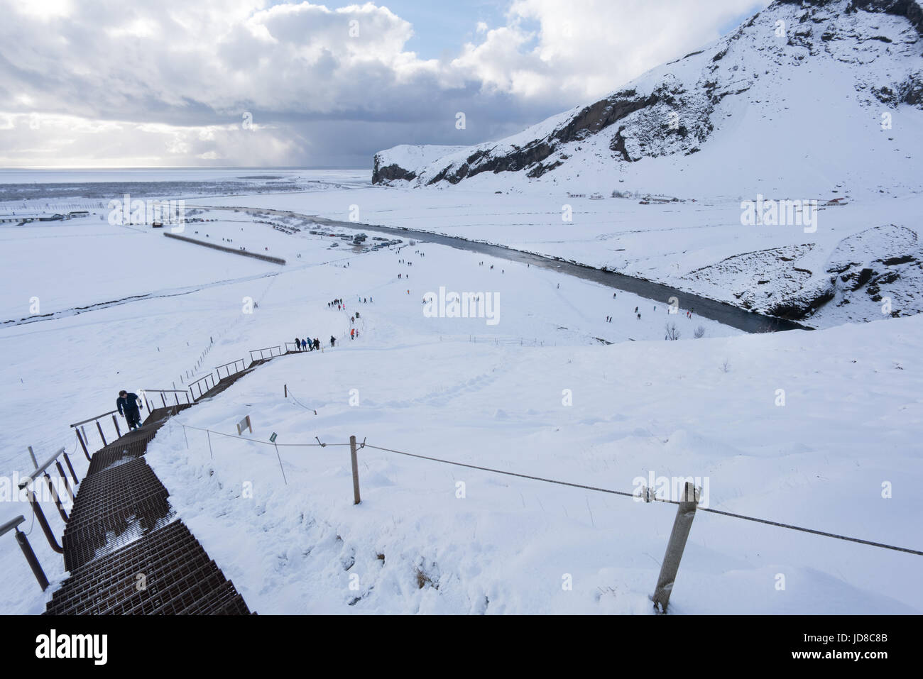 Person ascending steps in deep snow covered landscape, Iceland, Europe ...