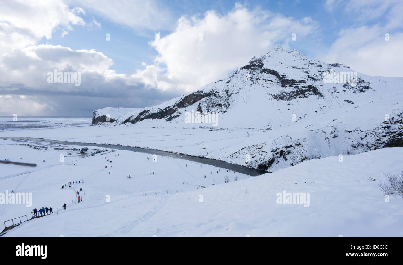 Person ascending steps in deep snow covered landscape, Iceland, Europe ...