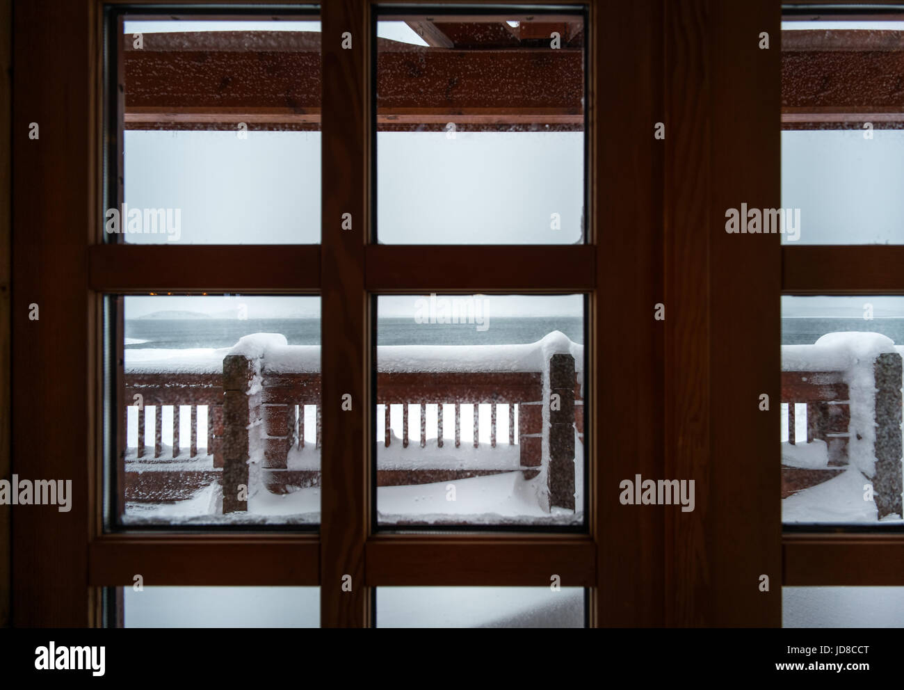 Looking at horizon through window of log cabin, Iceland, Europe ...