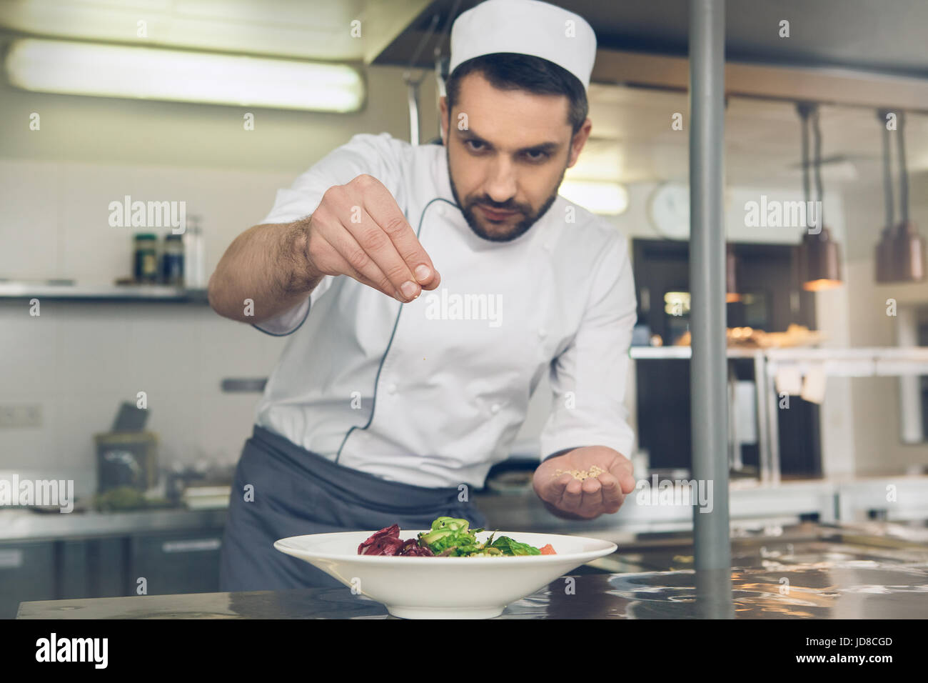 Male japanese restaurant chef cooking in the kitchen season dish Stock ...