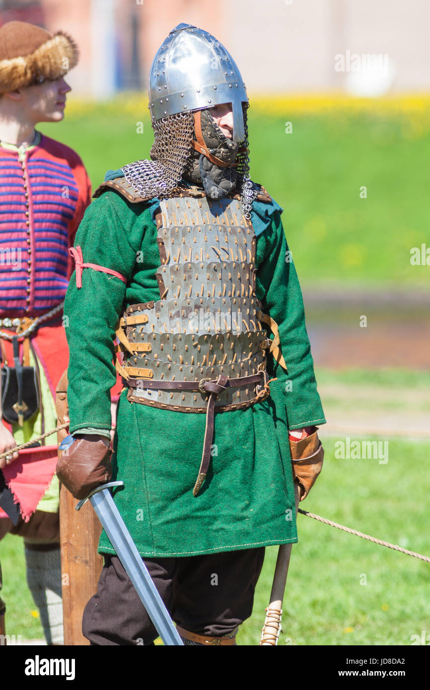 Swordsman in armor at the festival `Legends of the Norwegian Vikings ...