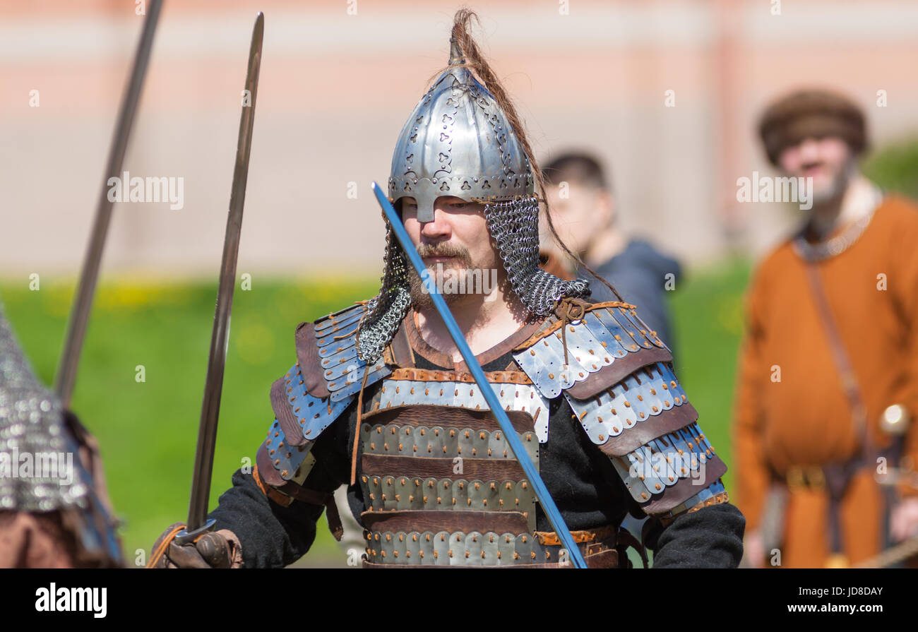 Swordsman in armor at the festival `Legends of the Norwegian Vikings ...